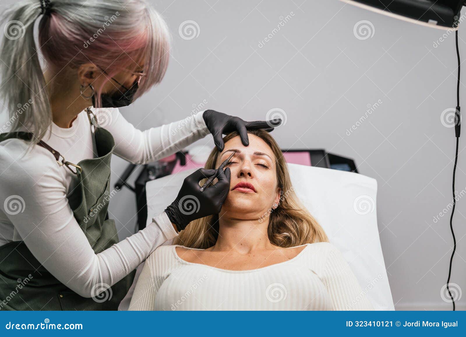 Professional Preparing Client for Microblading Eyebrow Procedure Stock ...