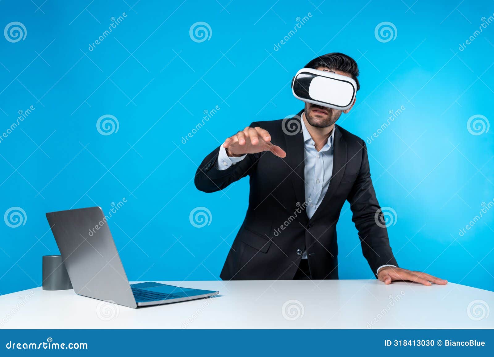 Project Manager Looking by Using VR Goggle while Sitting at Laptop ...