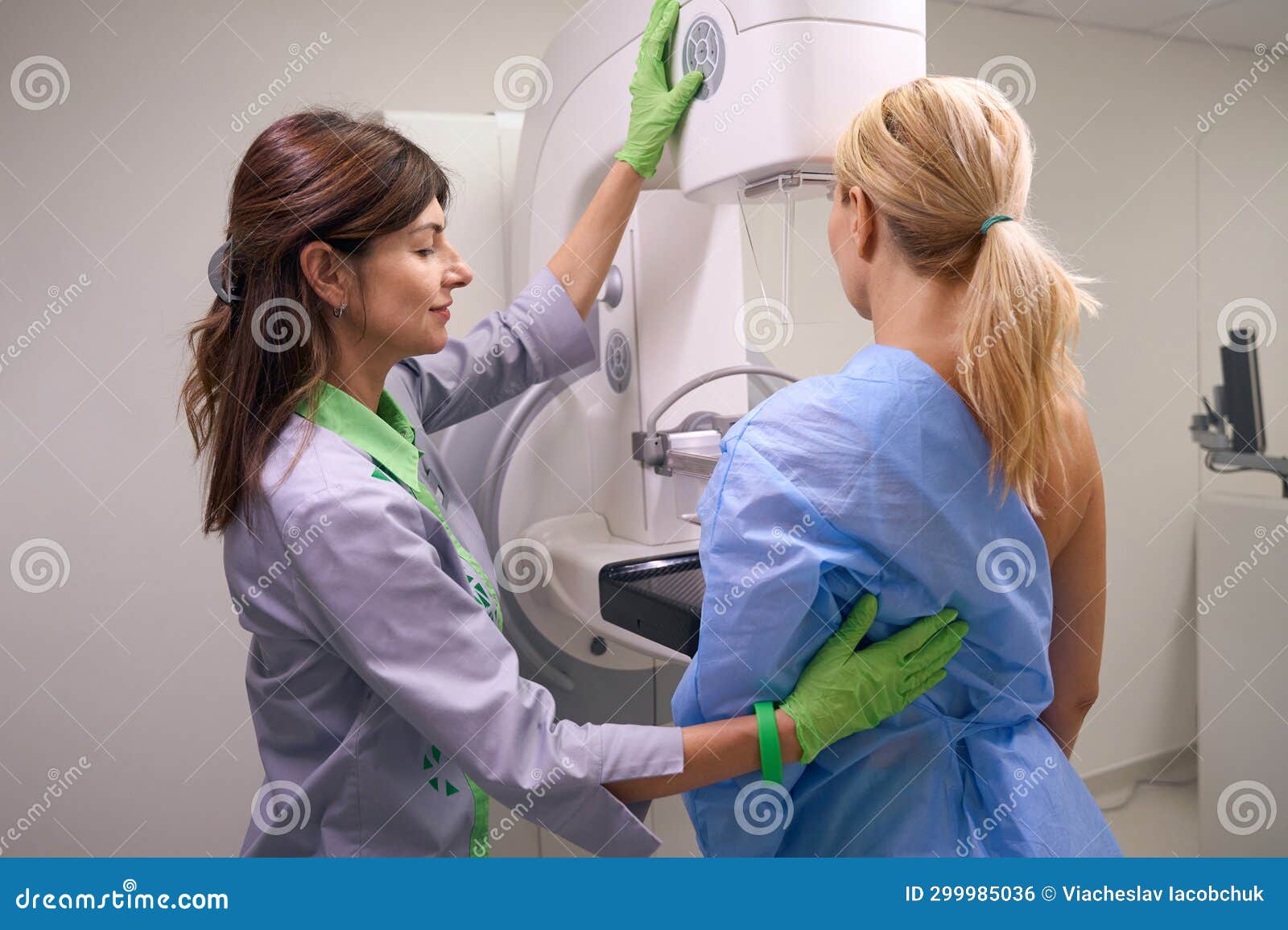 Professional Radiographer Preparing Client for Diagnostic Mammogram ...