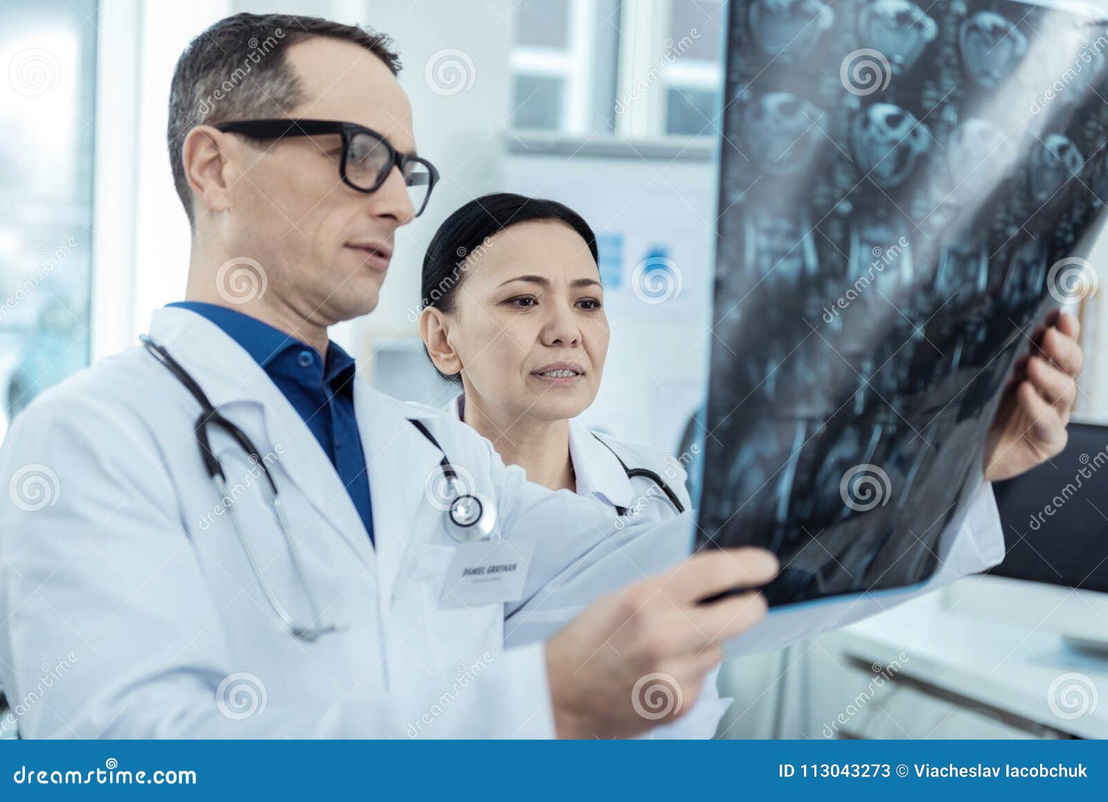 Professional Radiologists Holding a Scan Stock Image - Image of labcoat ...