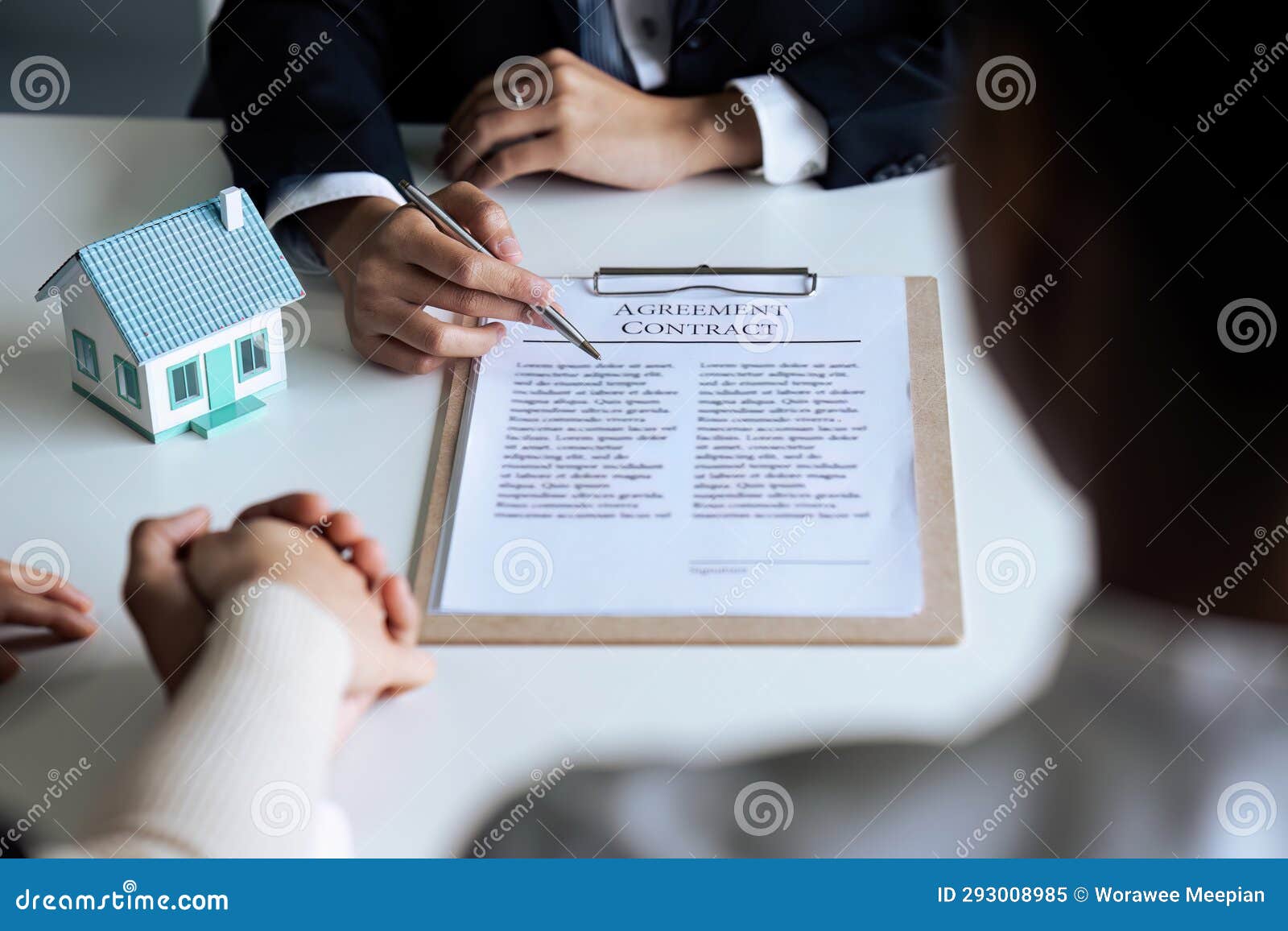 Professional Real Estate Agent Explaining the Document Process To the ...