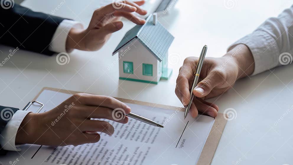 Professional Real Estate Agent Guiding and Explaining the Document ...