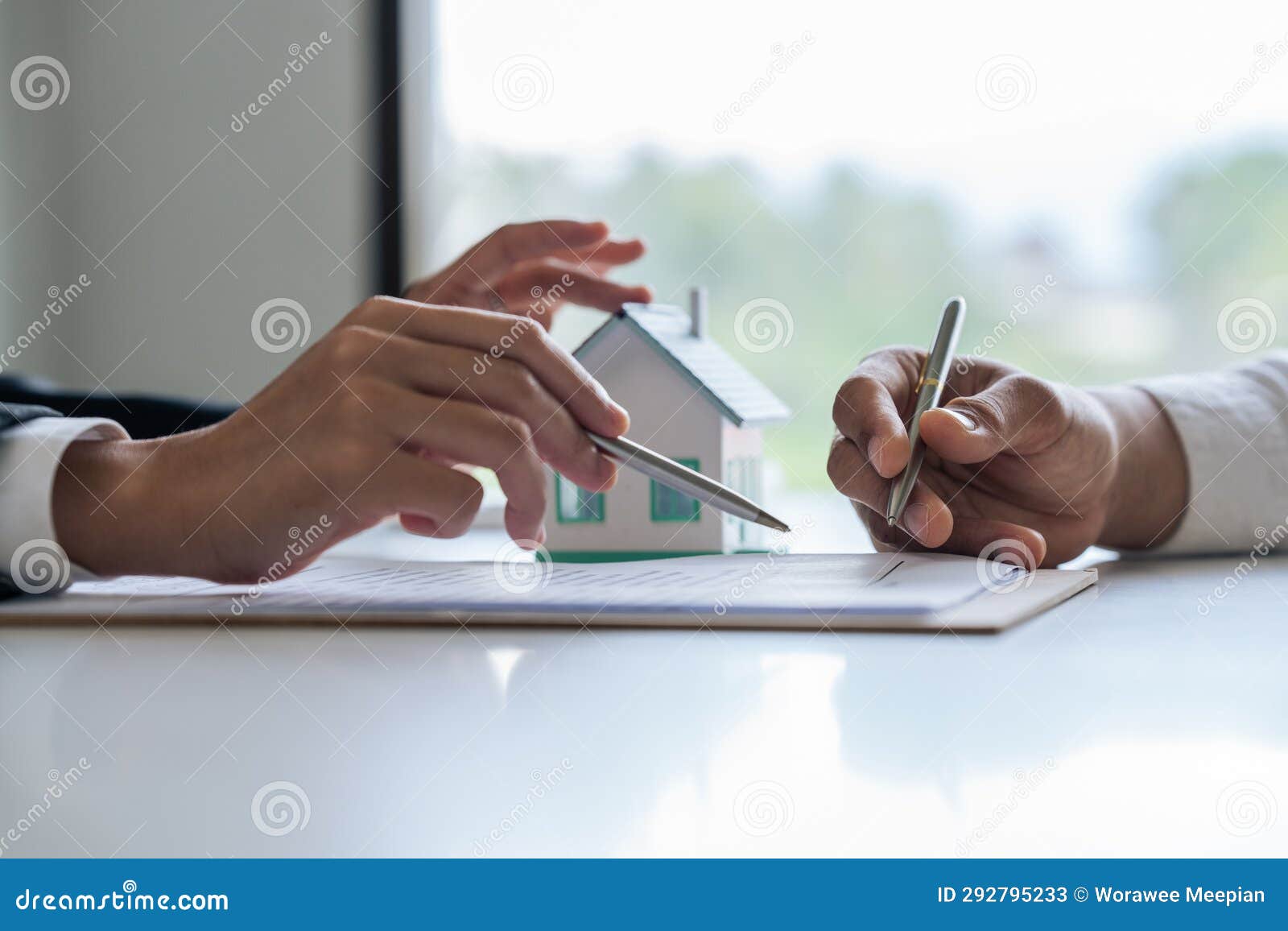 Professional Real Estate Agent Guiding and Explaining the Document ...