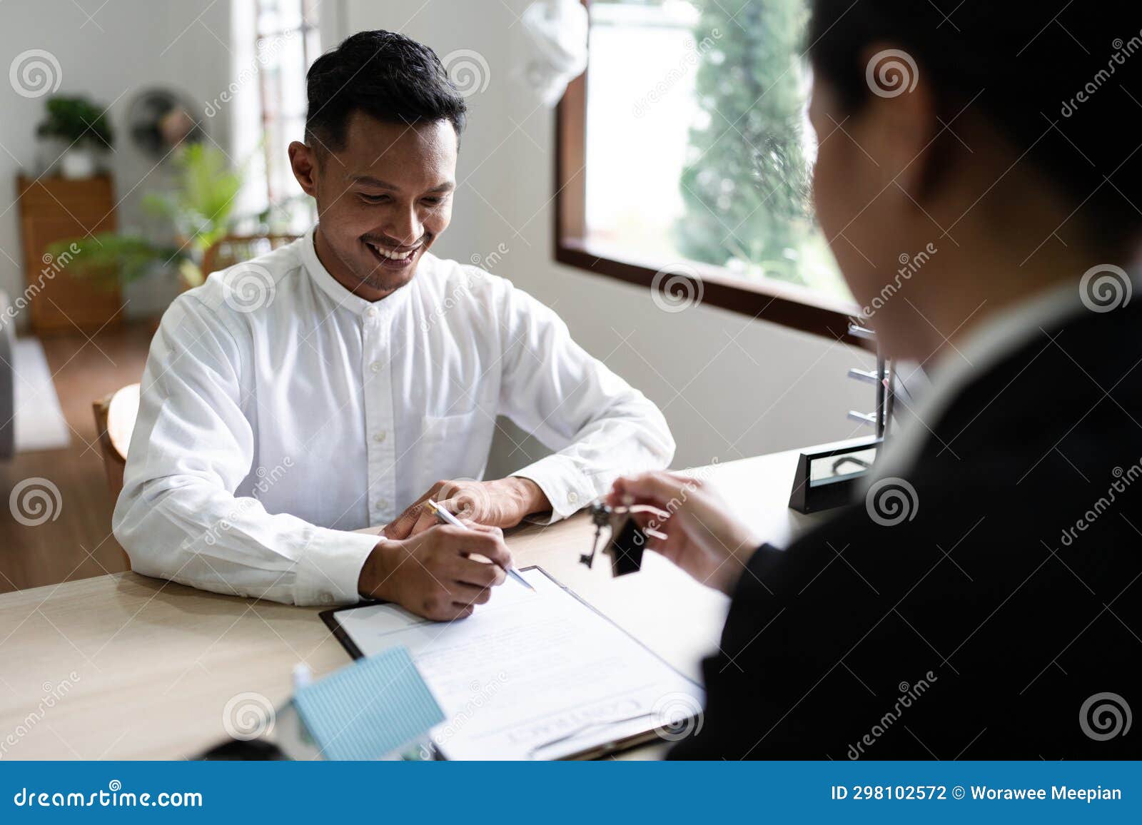 Professional Real Estate Agent Guiding and Explaining the Document ...