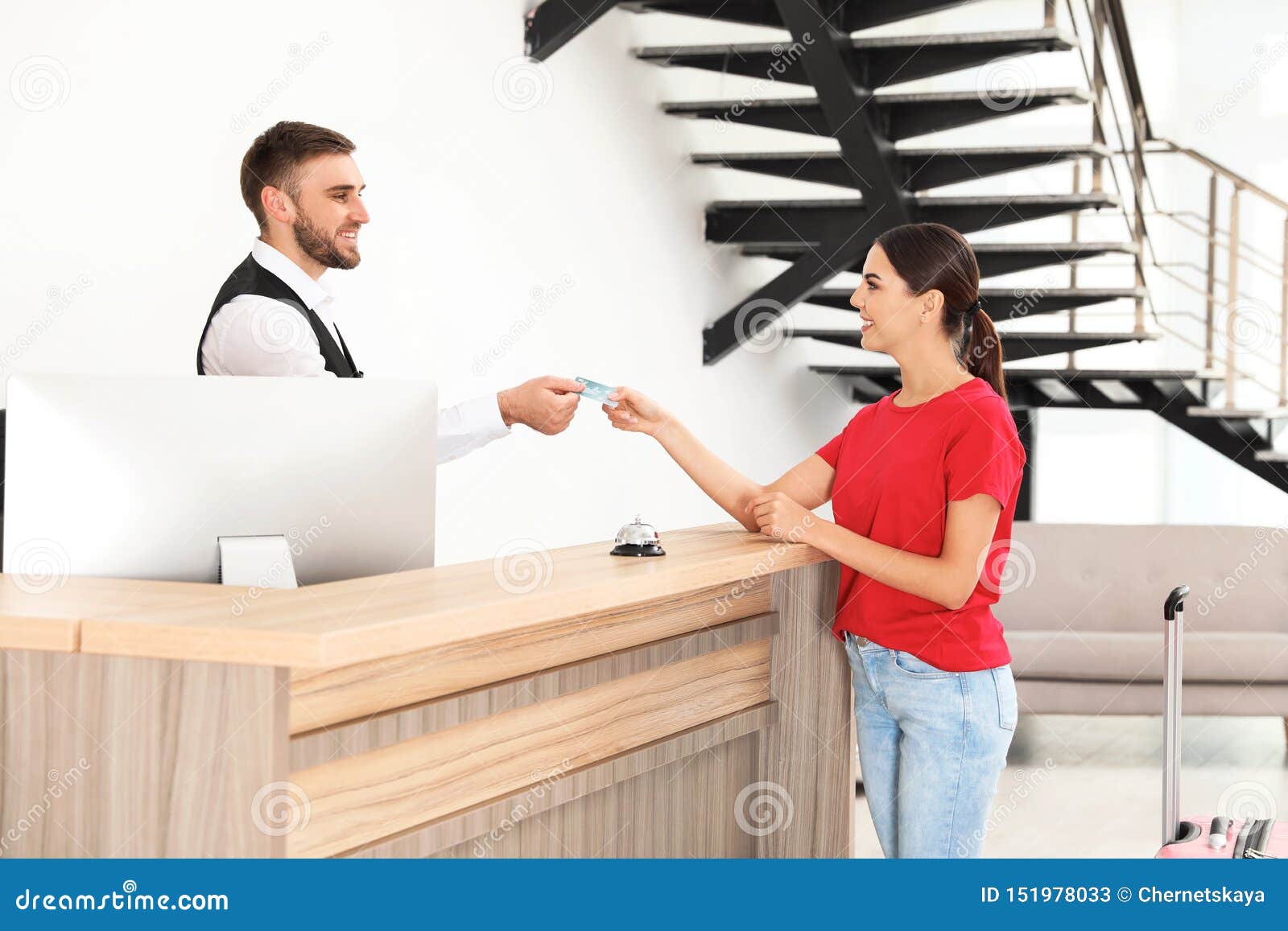 Professional Receptionist Working with Client at Desk Stock Image ...