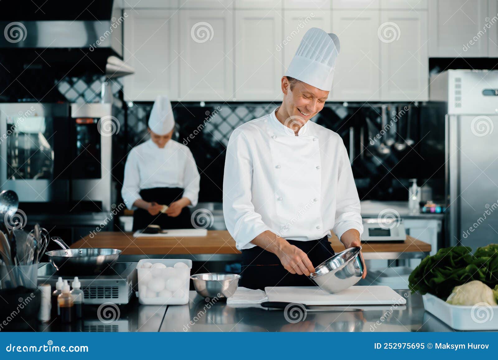 Professional Restaurant Kitchen: Chefs Prepare a Delicious Dish Stock ...