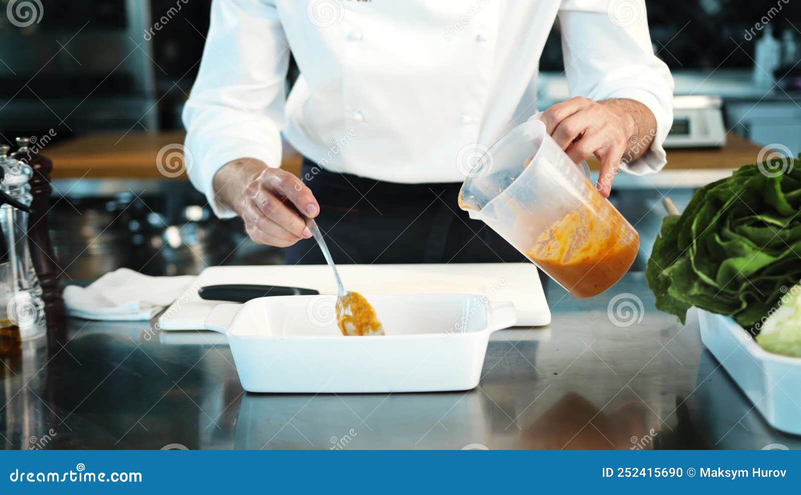 Professional Restaurant Kitchen, Close-up: the Chef Creates Sauce for ...