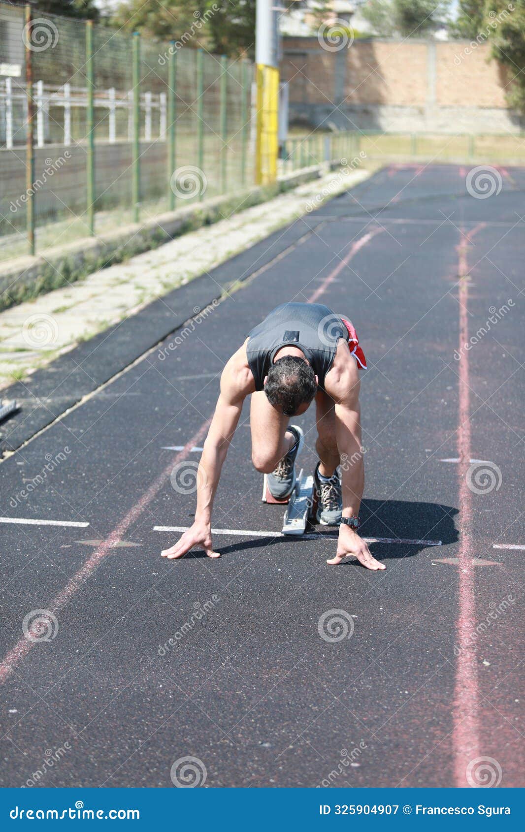 Runner on the Starting Blocks in Position Stock Image - Image of ...