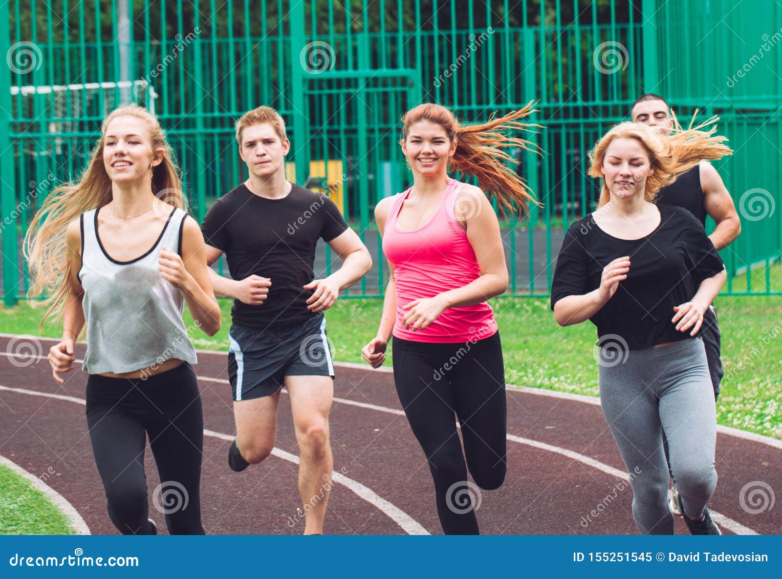 Professional Runners Running on a Race Track Stock Image - Image of ...