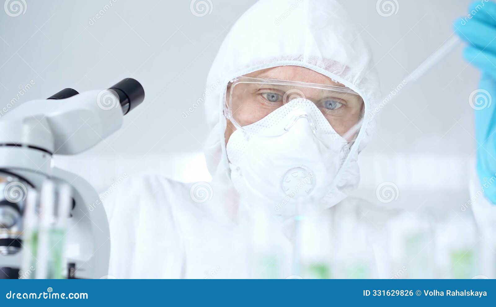 Professional Scientist in Protective Gear is Using Pipette and ...