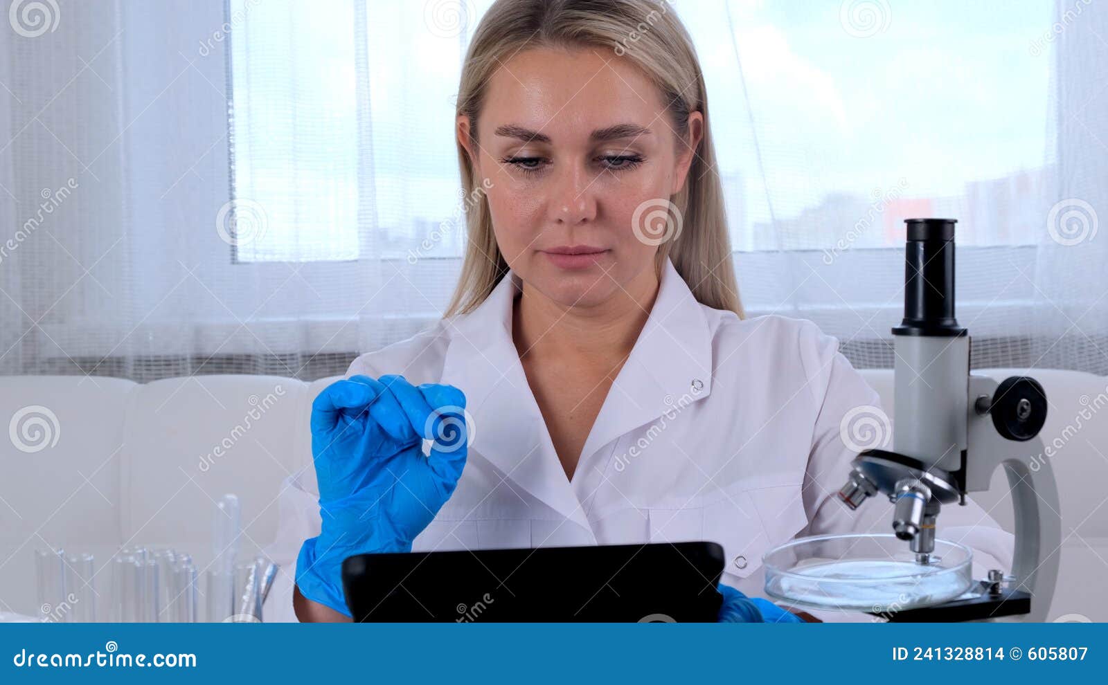Professional Scientist Research Chemist with a Tablet Computer and a ...