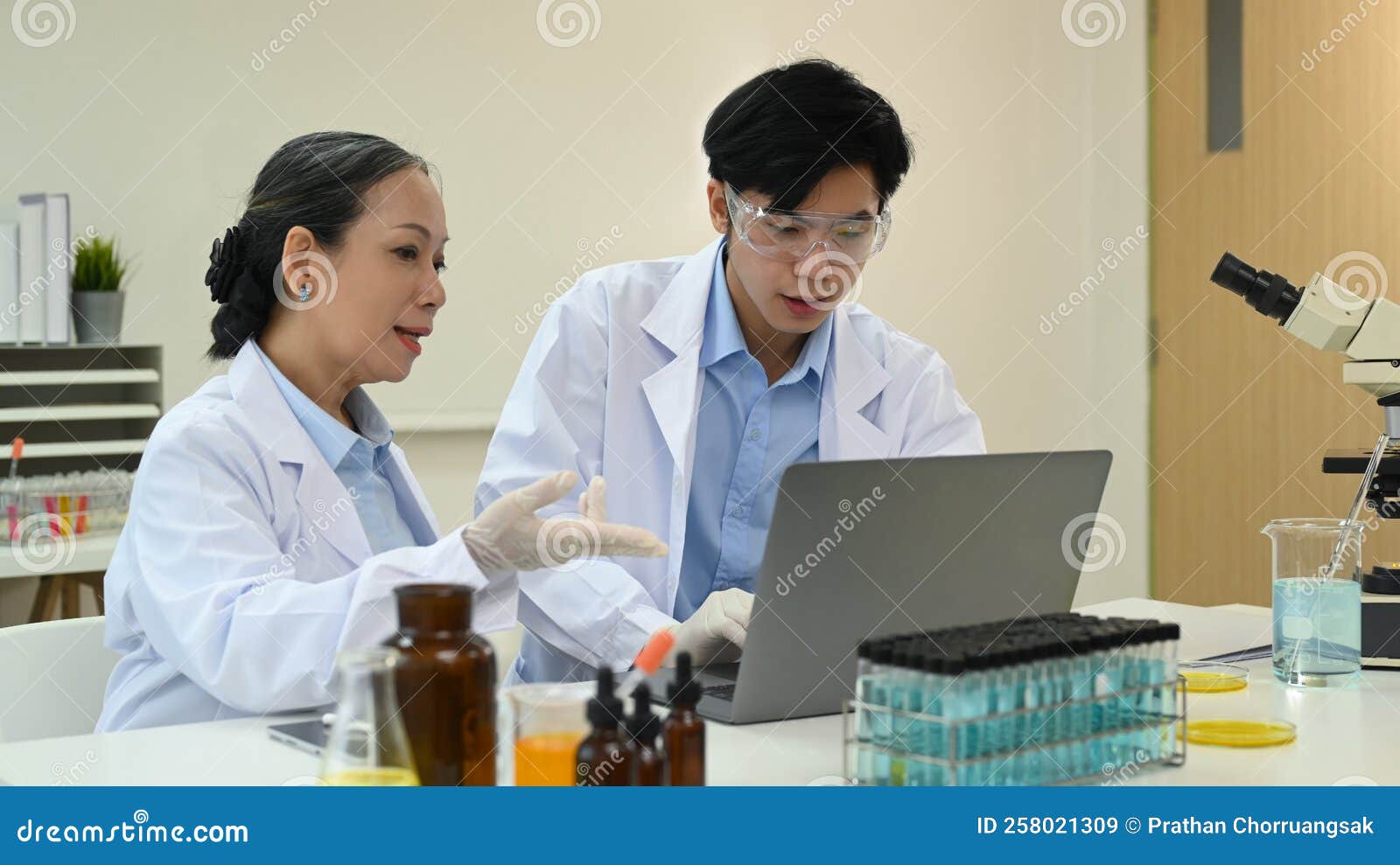 Professional Scientists are Analyzing Test Samples, Discussing about ...