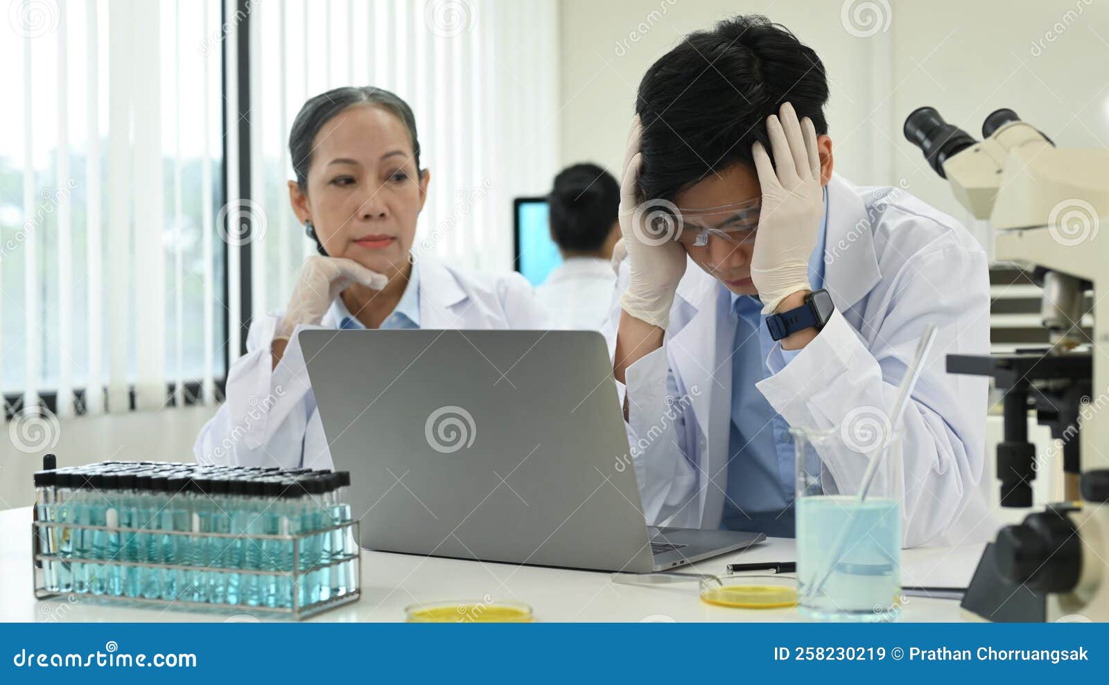 Professional Scientists Team Conducting Experiment in Modern Laboratory ... Professional Scientists Team Conducting Experiment in Modern Laboratory ...