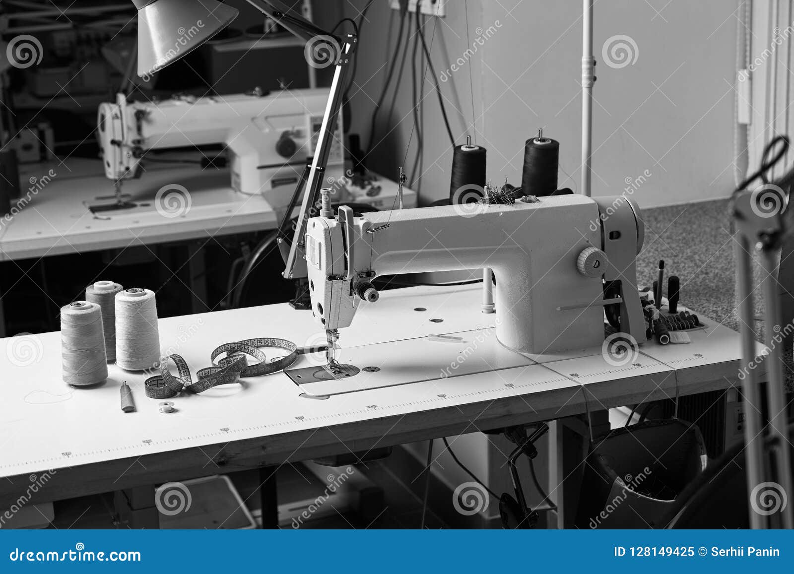Professional Seamstress Working Space with Sewing Machine, Thread ...