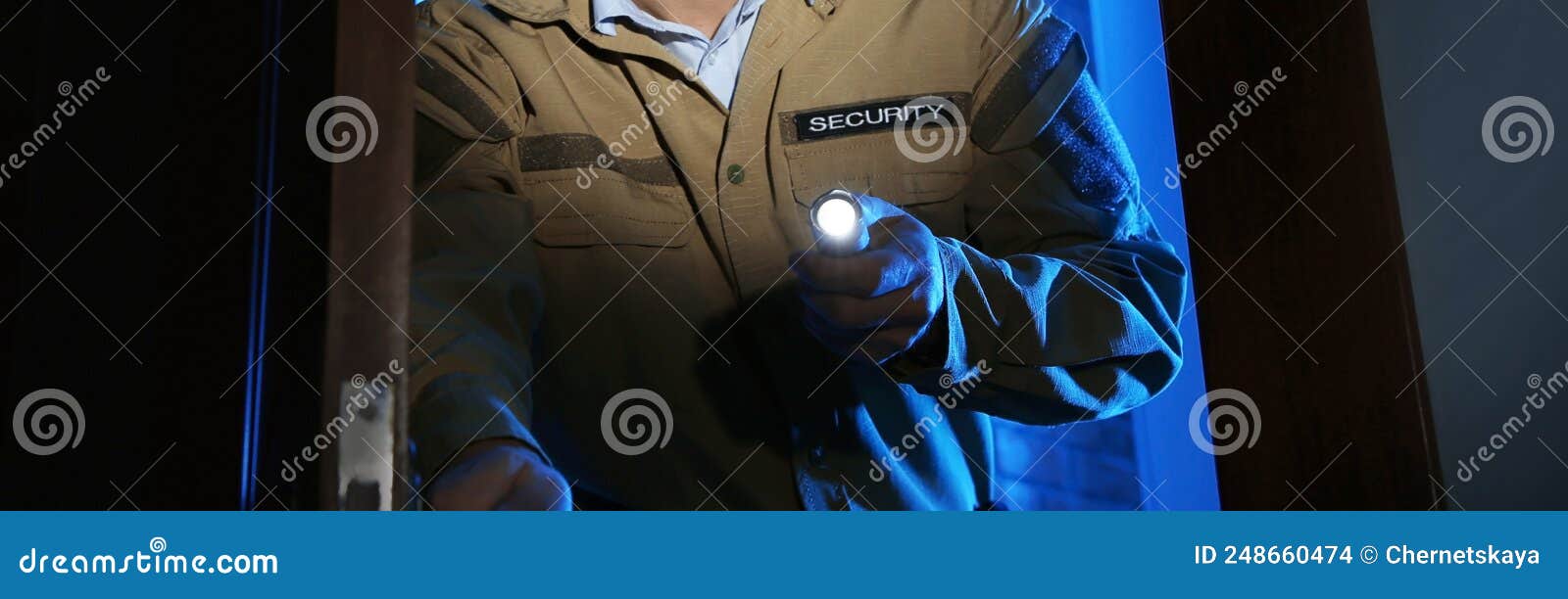 Professional Security Guard with Flashlight Checking Dark Room. Banner ...