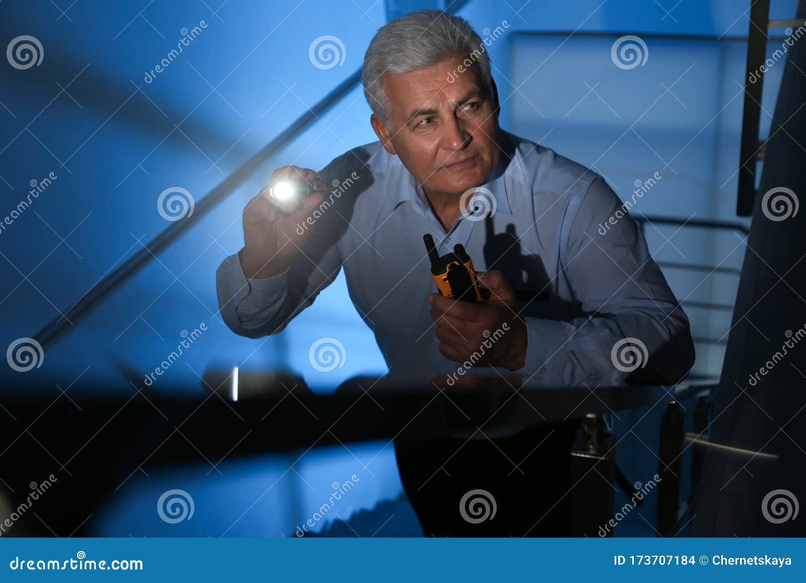 Professional Security Guard with Flashlight on Stairs in Dark Room ...