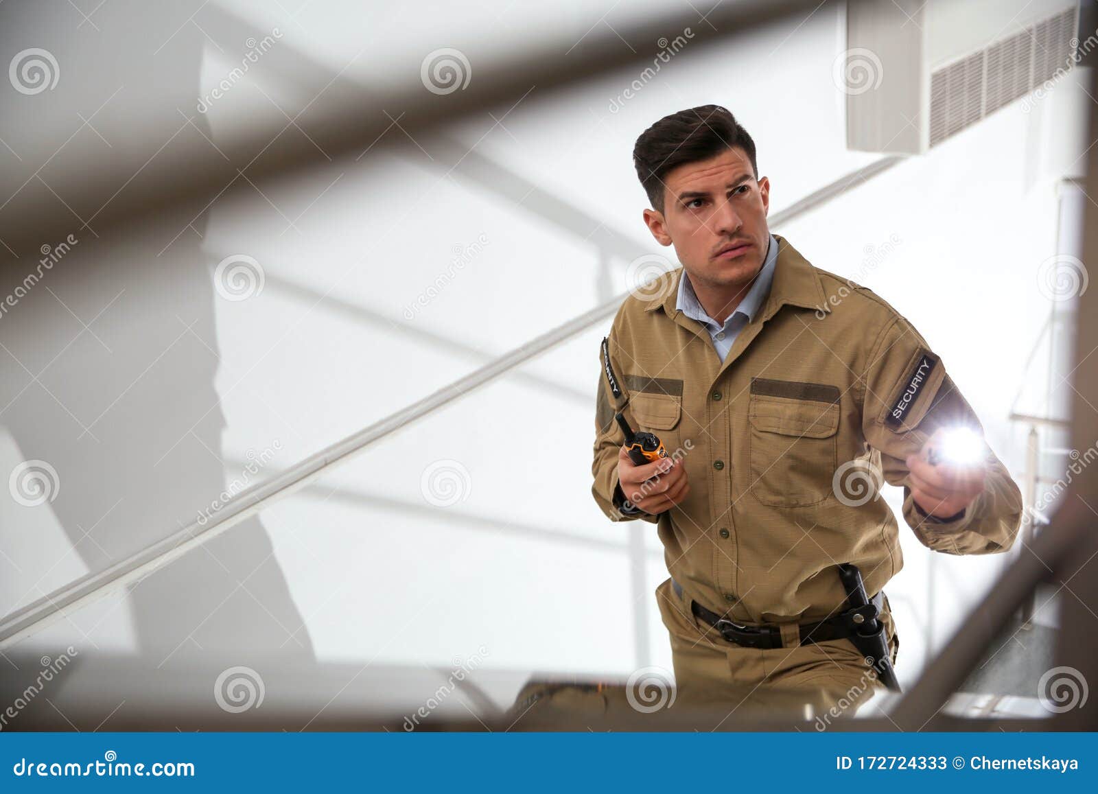 Professional Security Guard with Portable Radio Set and Flashlight ...