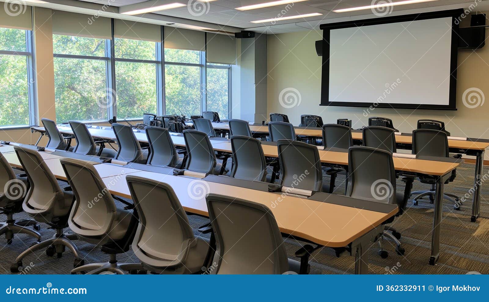 A Professional Seminar Room Setup with Clean Seating and a Projector ...