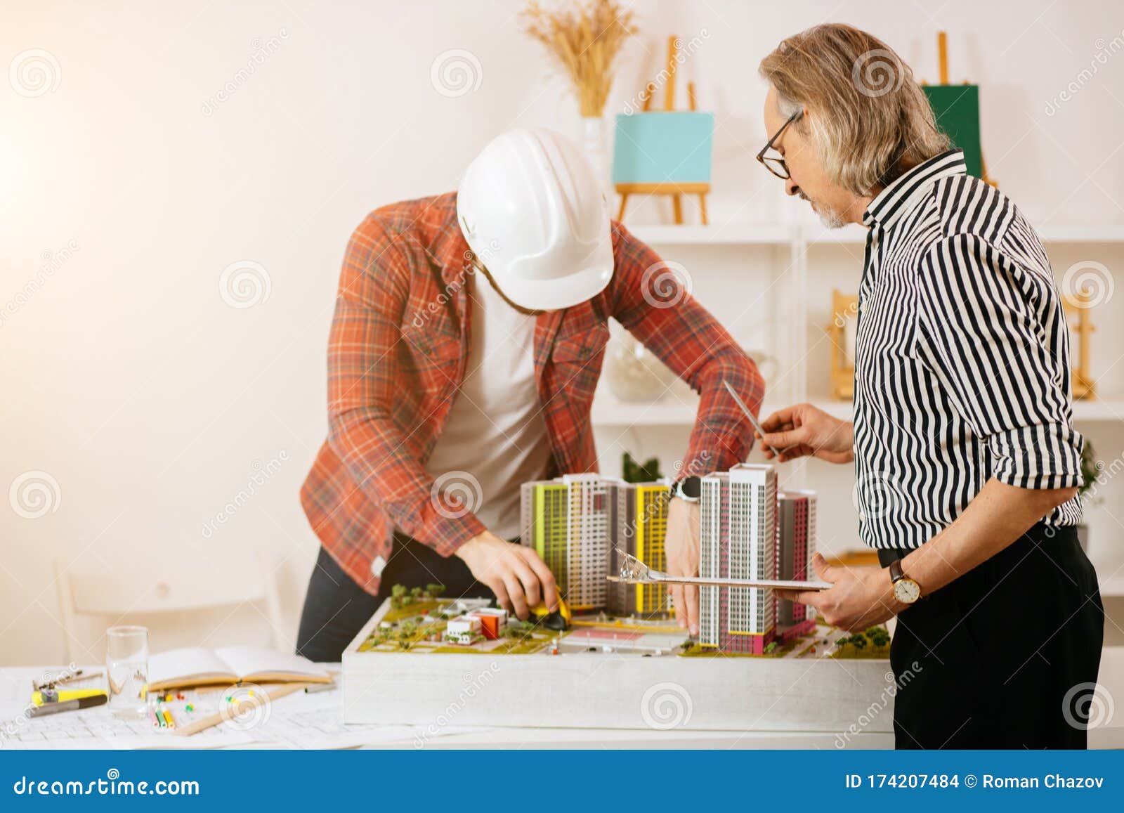 Senior Man Architect Controls the Process of Creating Building Model by ...