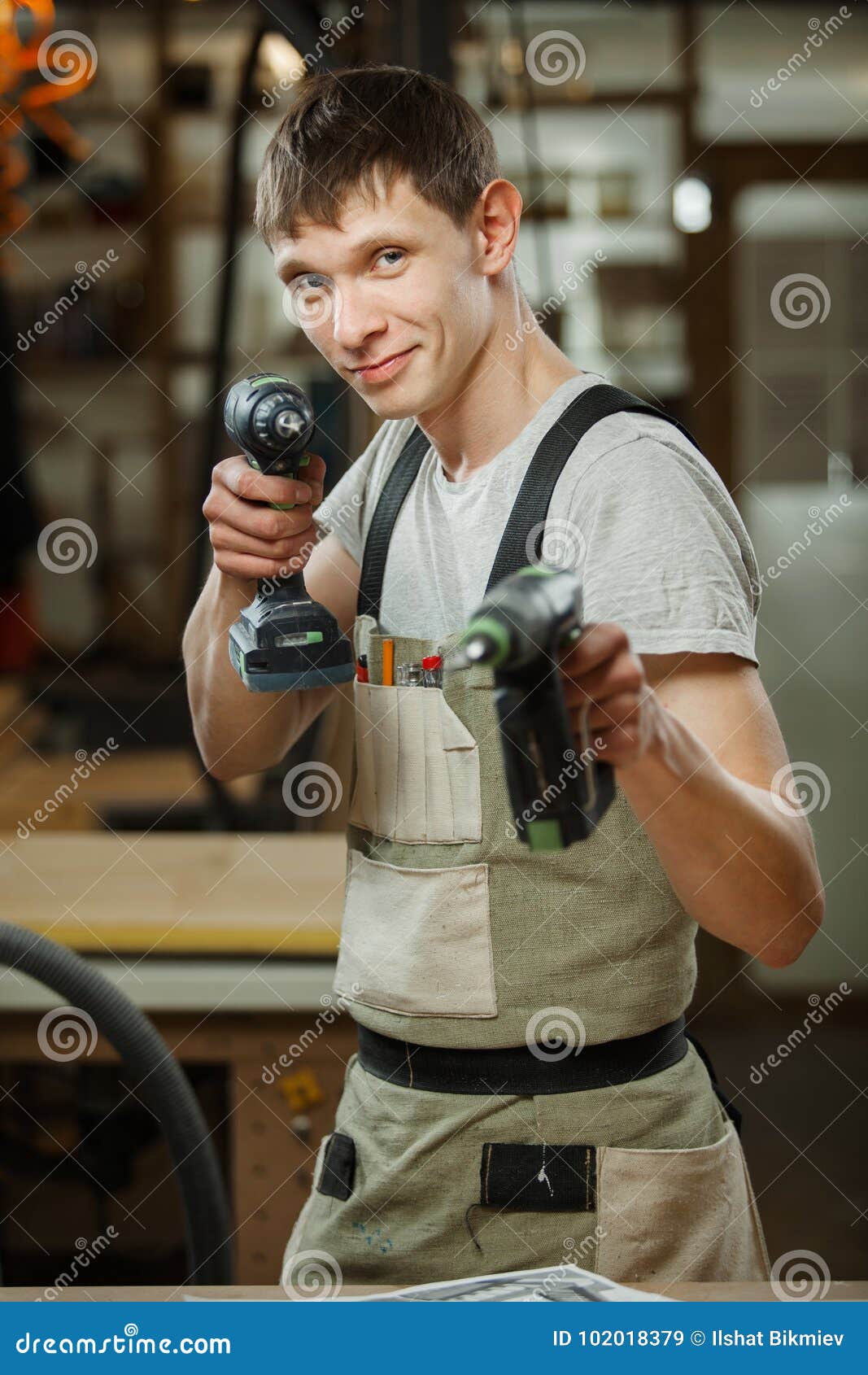 Professional Service Worker with Electric Drill and Screwdriver in ...