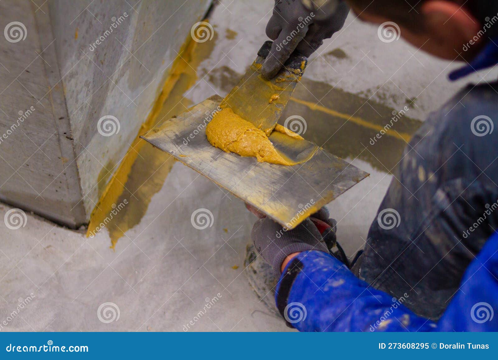 Professional is Skillfully Filling the Expansion Joints with Epoxy ...