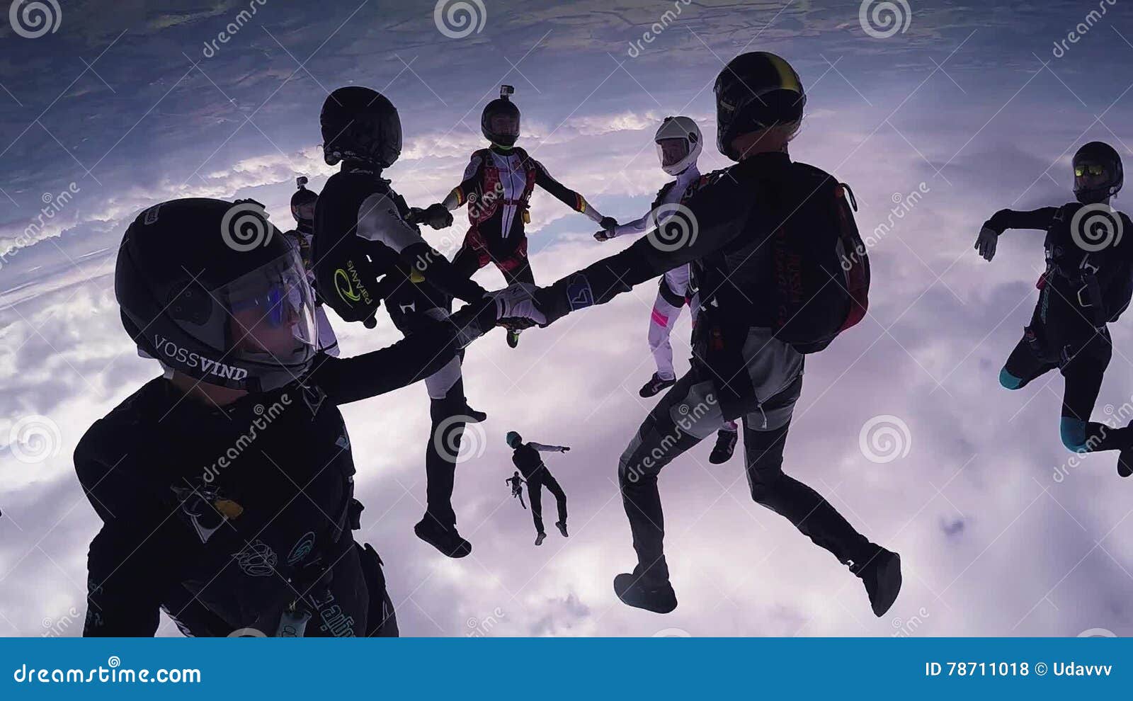Professional Skydivers Make Formation in Cloudy Sky. Extreme. Flight ...