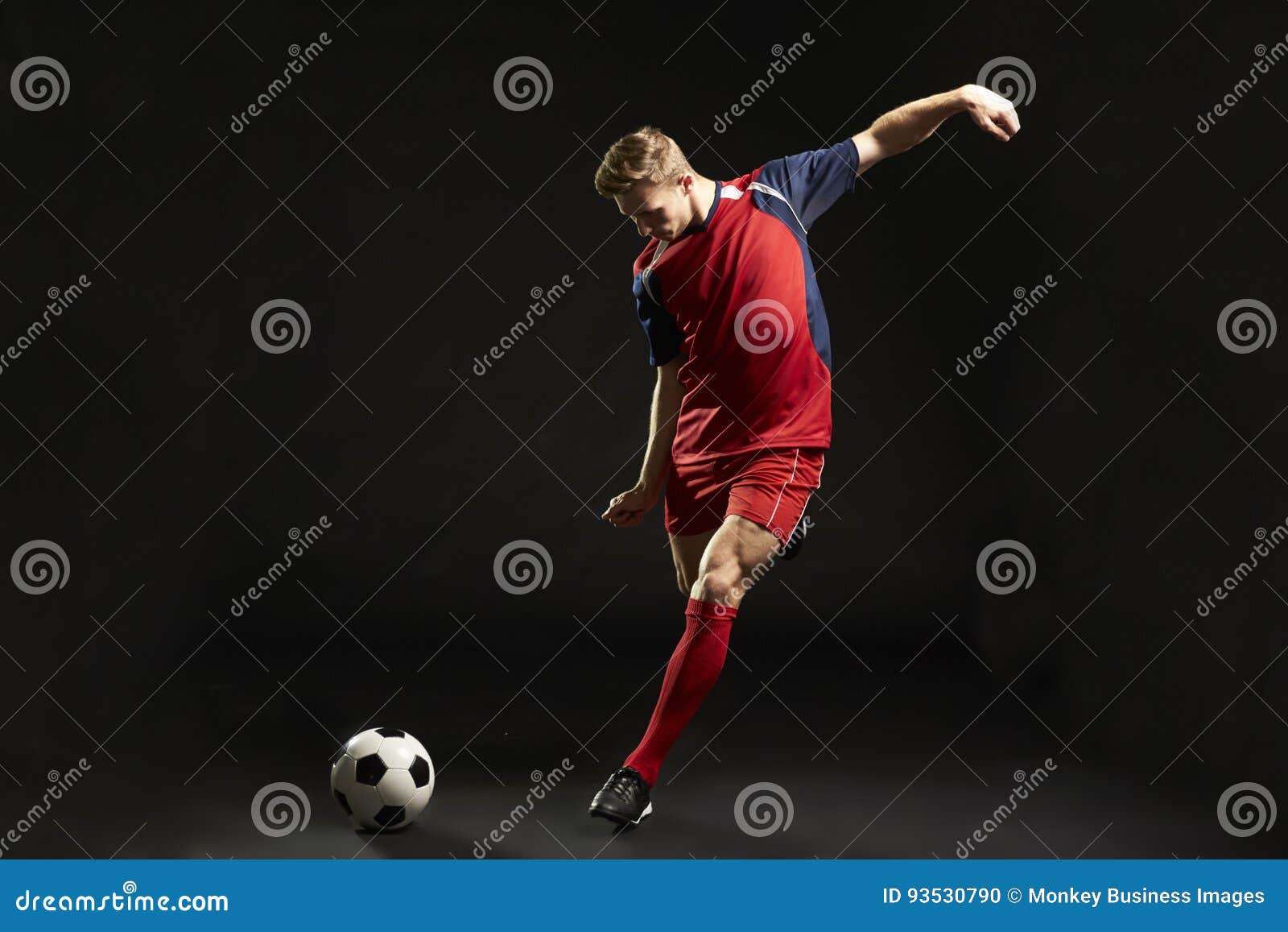 Professional Soccer Player Shooting at Goal in Studio Stock Photo ...
