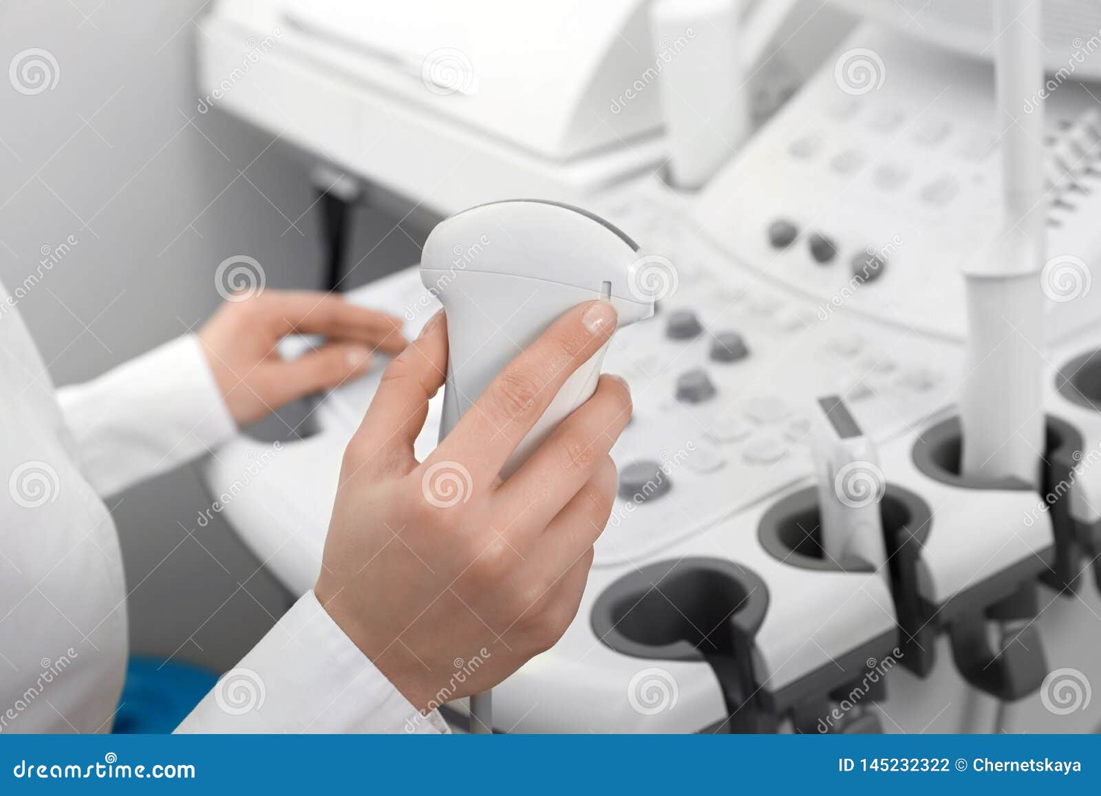 Professional Sonographer Using Ultrasound Machine in Clinic, Stock ...