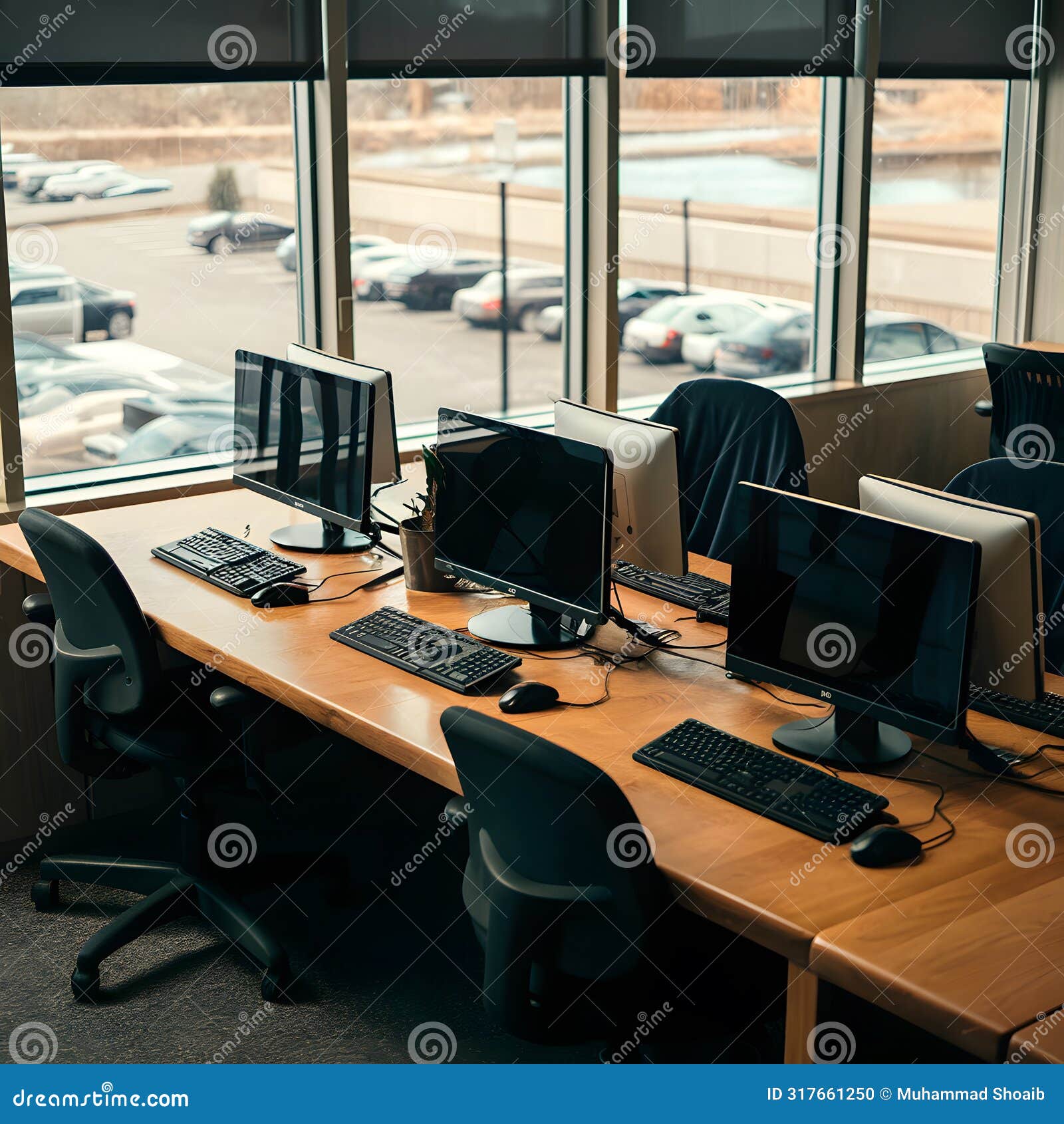 Professional, Spacious Office Setup With Three Monitors, Keyboards ...
