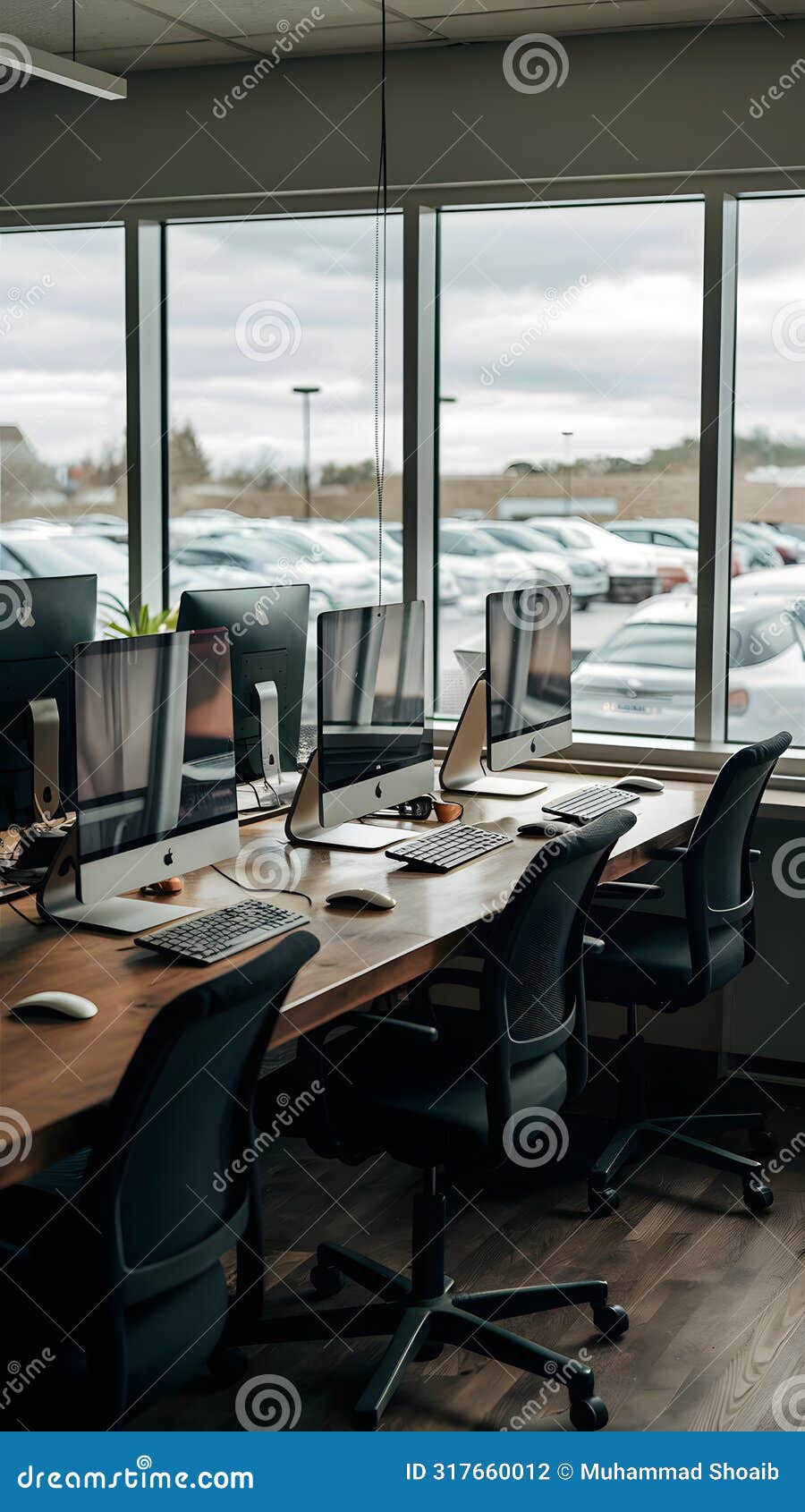 Professional, Spacious Office Setup with Three Monitors, Keyboards ...