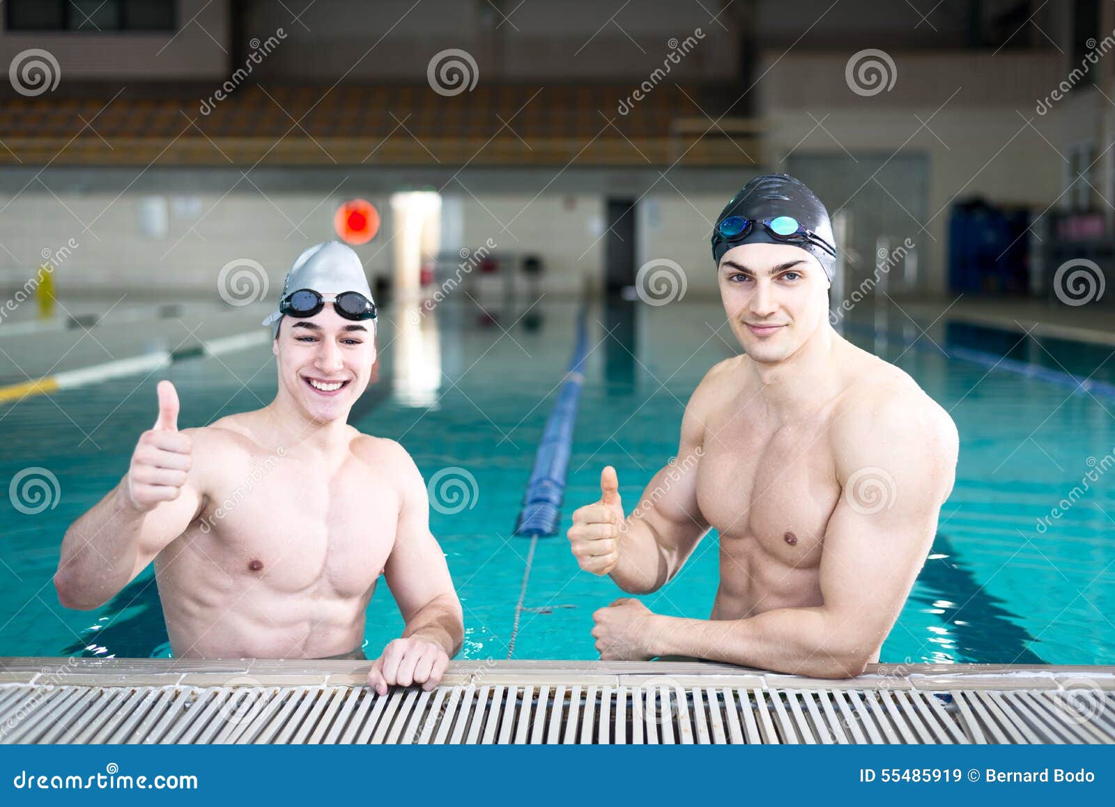 Professional Swimmers Gesturing Thumbs Up Stock Image - Image of ...