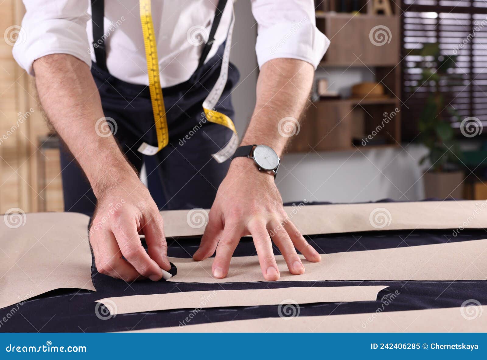 Professional Tailor Marking Sewing Pattern on Fabric with Chalk at ...