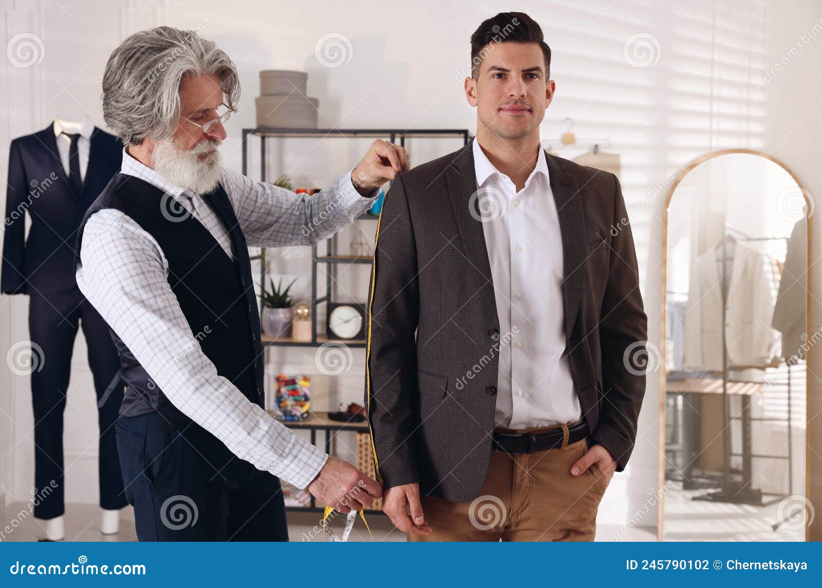 Professional Tailor Measuring Jacket Sleeve Length in Atelier Stock ...