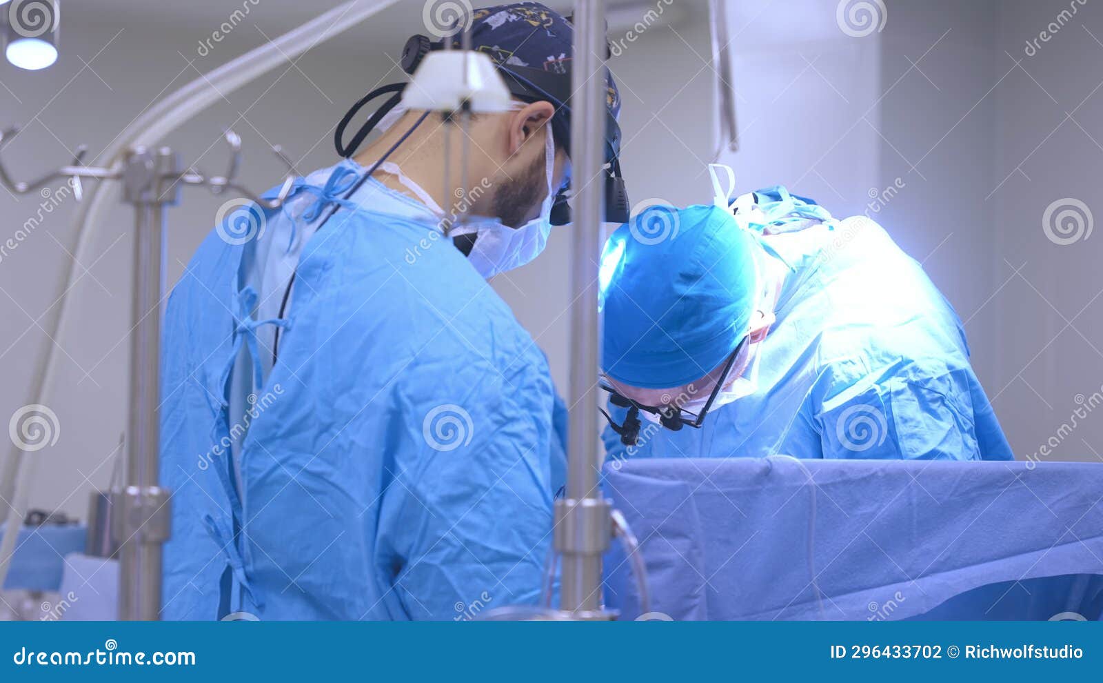 A Professional Team of Doctors, Surgeons and Nurses Perform Surgery on ...