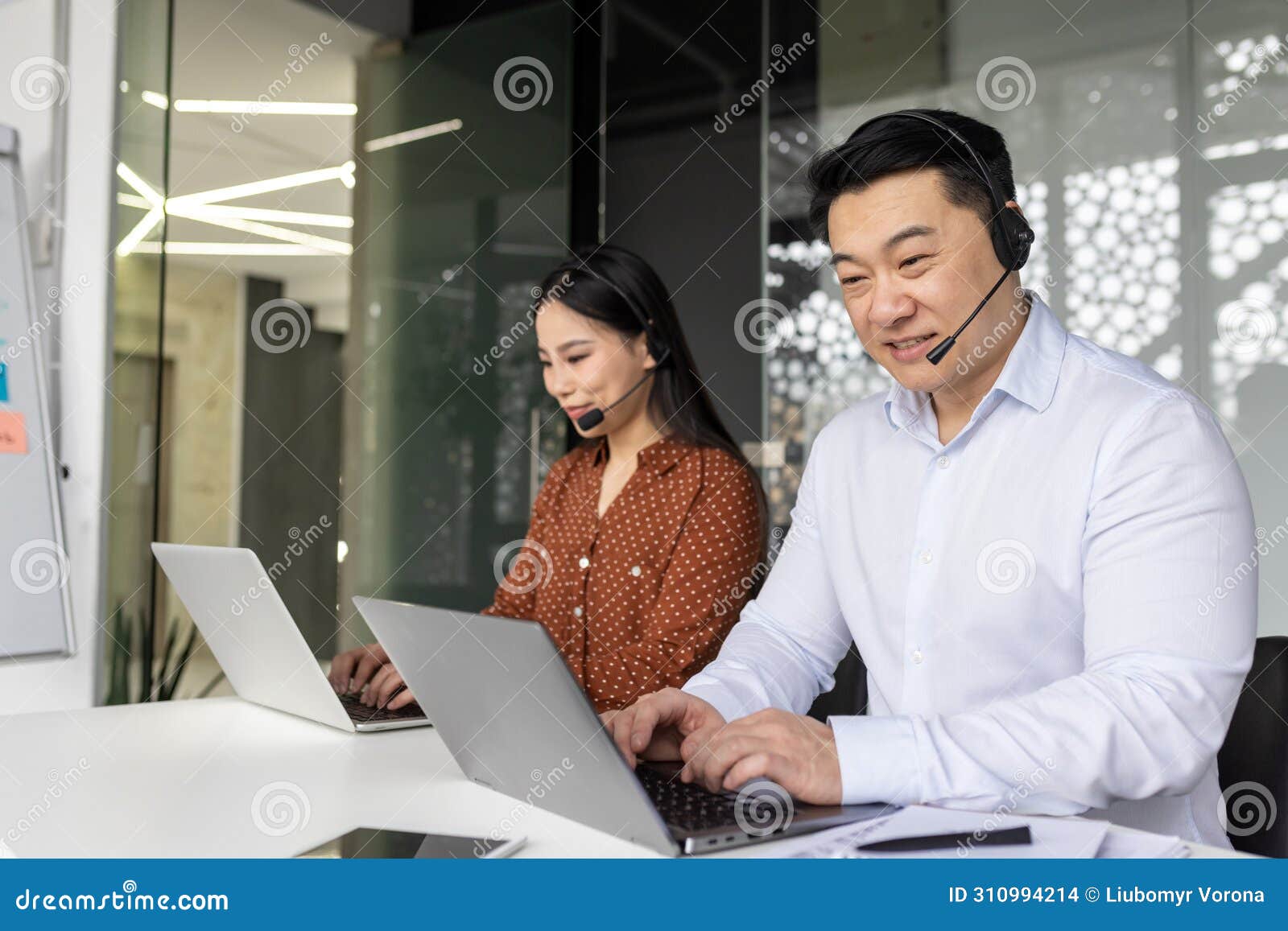 Professional Team Working on Laptops in Modern Office Stock Photo ...