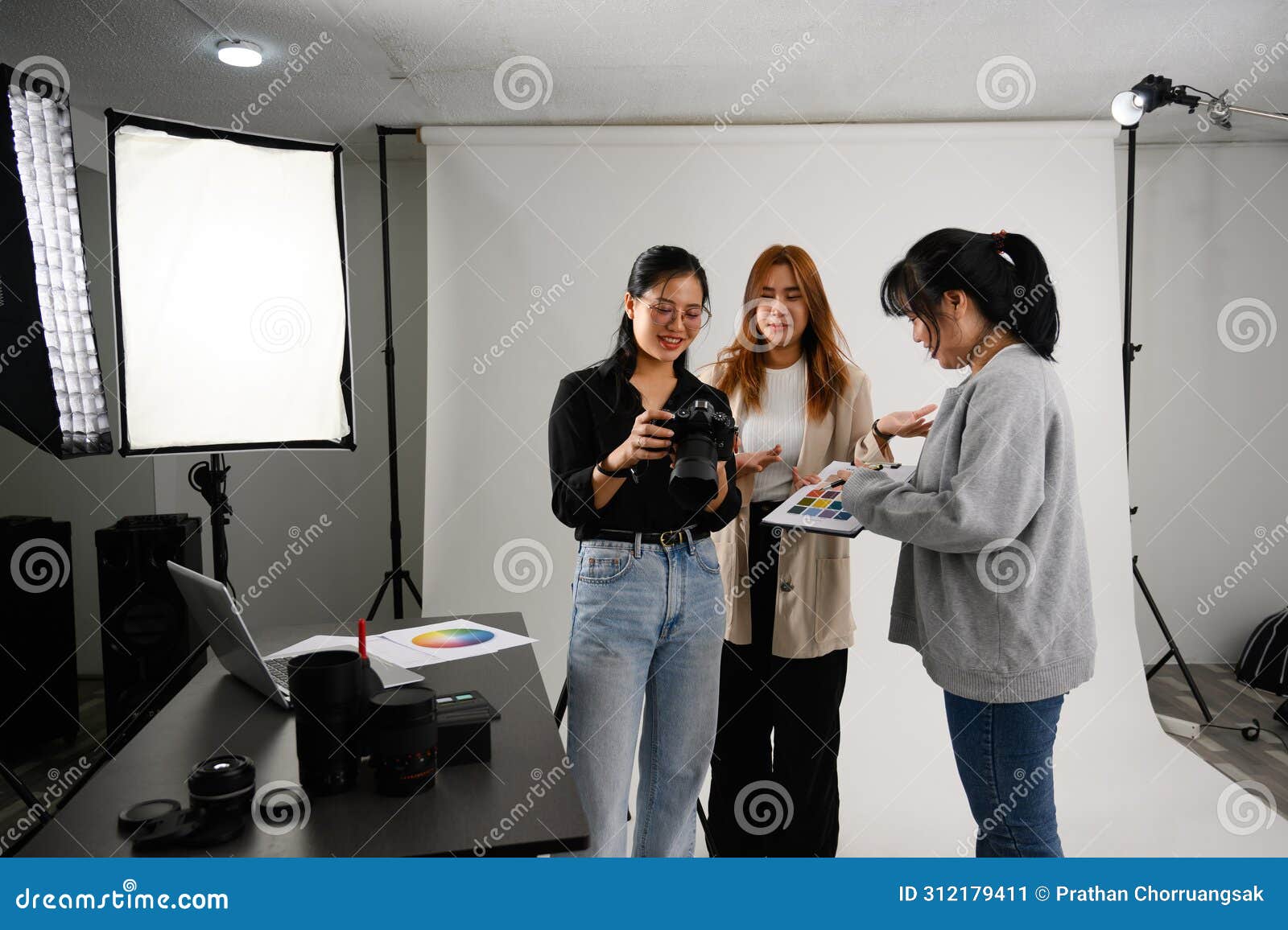 Professional Team Working Together in Photo Studio with Lighting ...