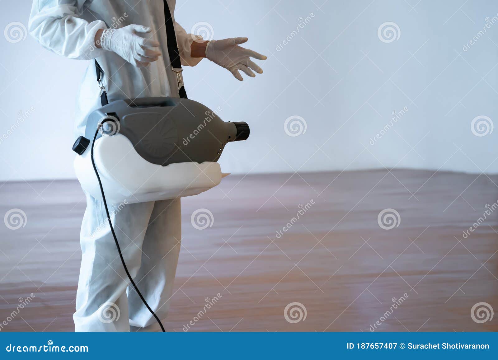 `Professional Technical Man in Prevention Suit Sprays Sterilizing ...