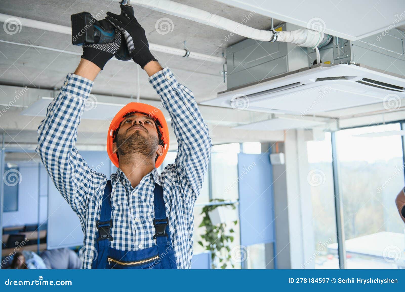 Professional Technician Maintaining Modern Air Conditioner Indoors ...