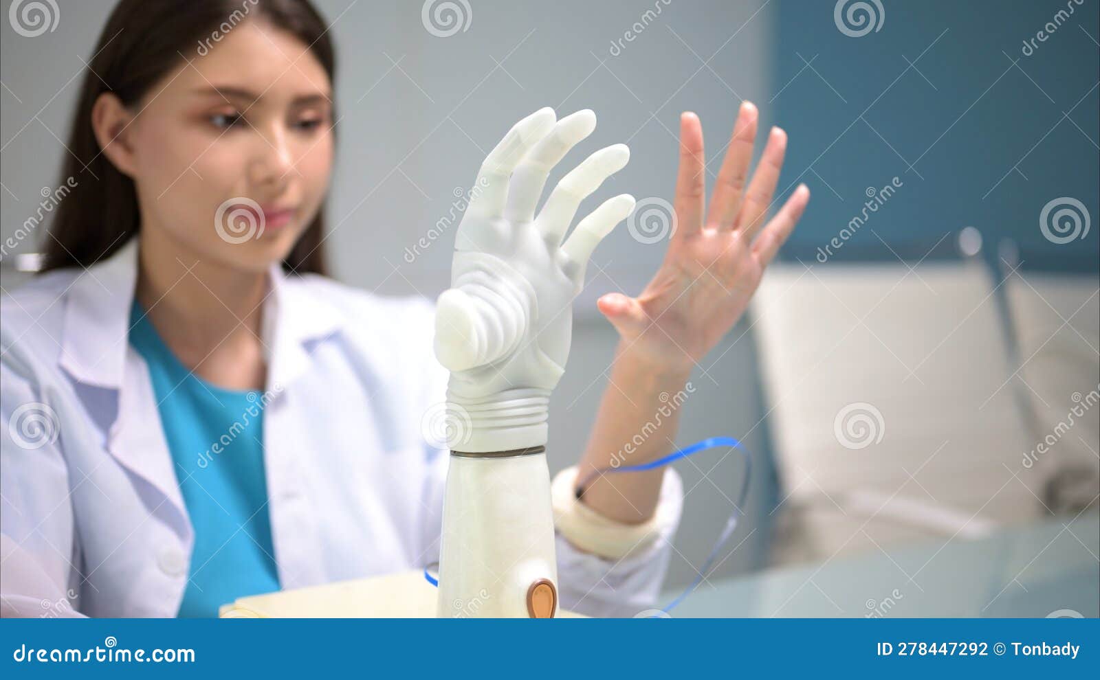 Technician Testing Robotic Bionic Arm at Prosthetic Manufacturing Stock ...