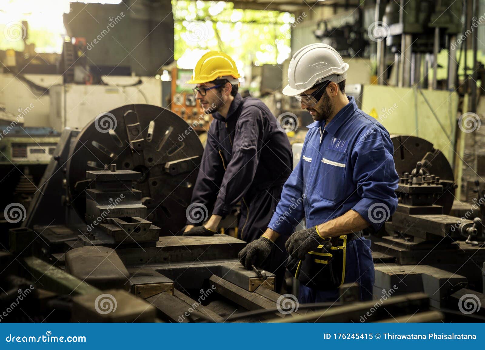 Professional Technicians and Engineers Wearing Protective Clothing are ...