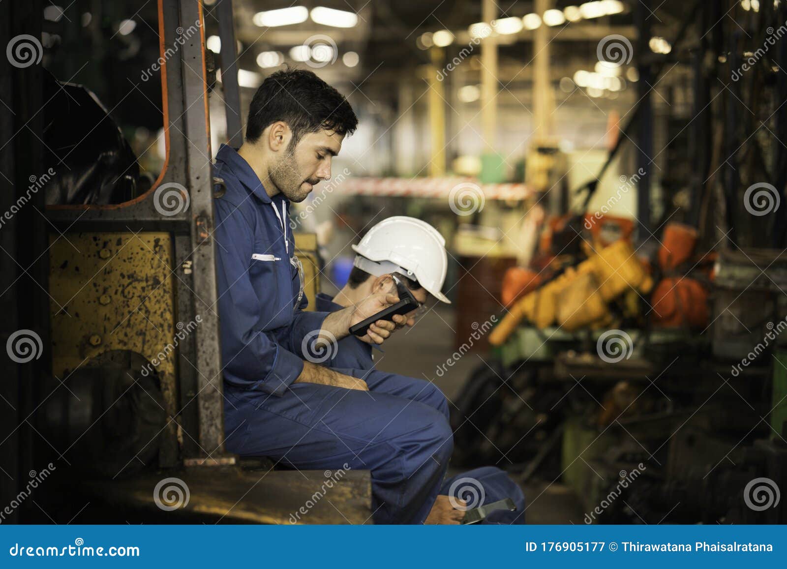 Professional Technicians are Resting and Using Mobile Phones Stock ...