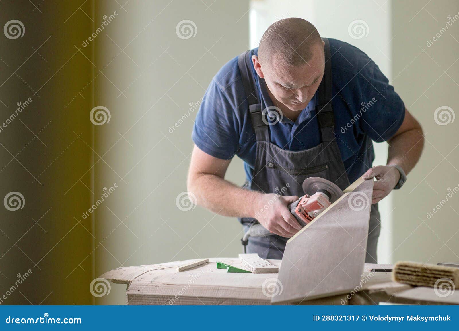 Professional Tiler Cutting Ceramic Tile for the Floor or Wall. Flooring ...