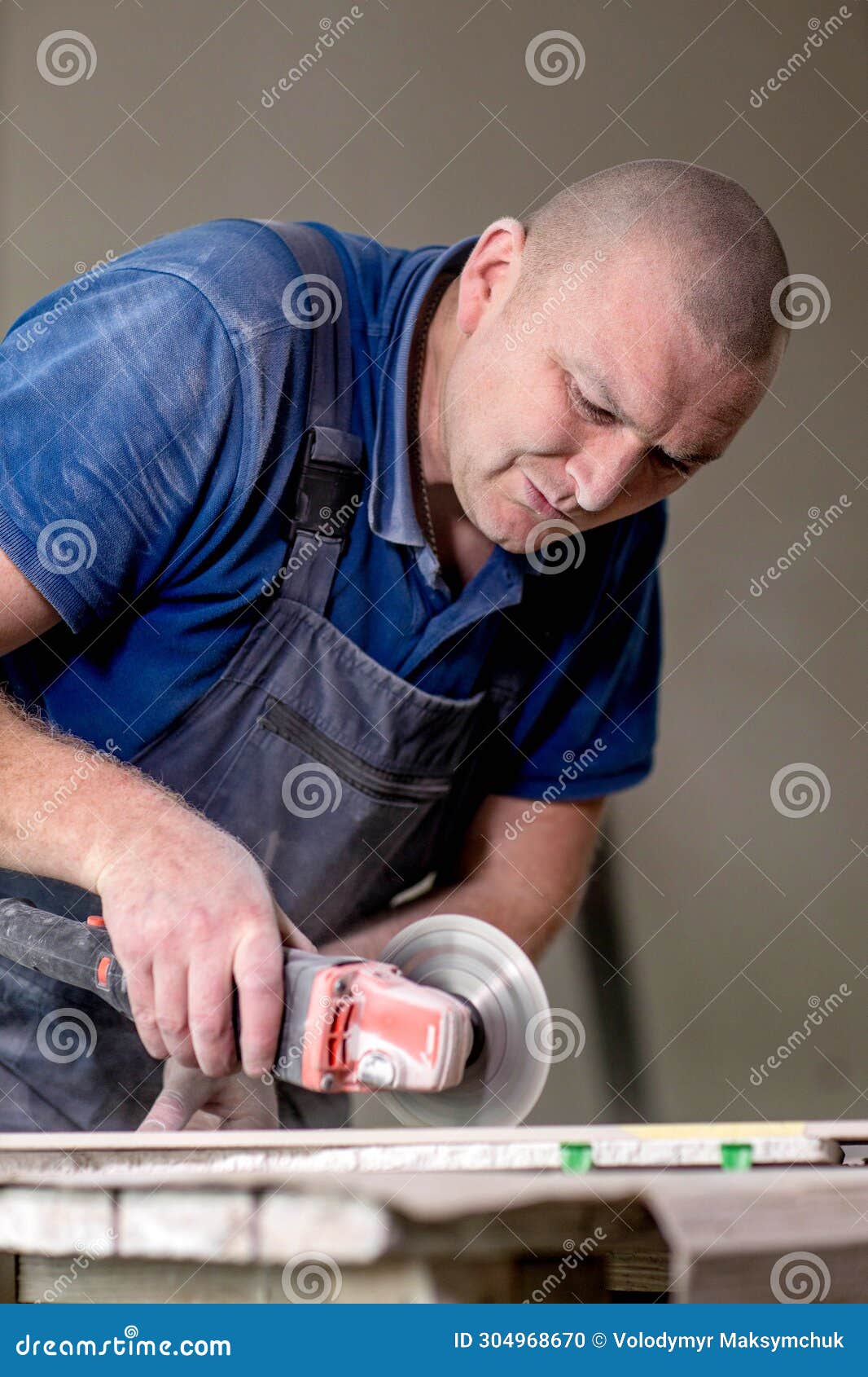 Professional Tiler Cutting Ceramic Tile for the Floor or Wall. Flooring ...