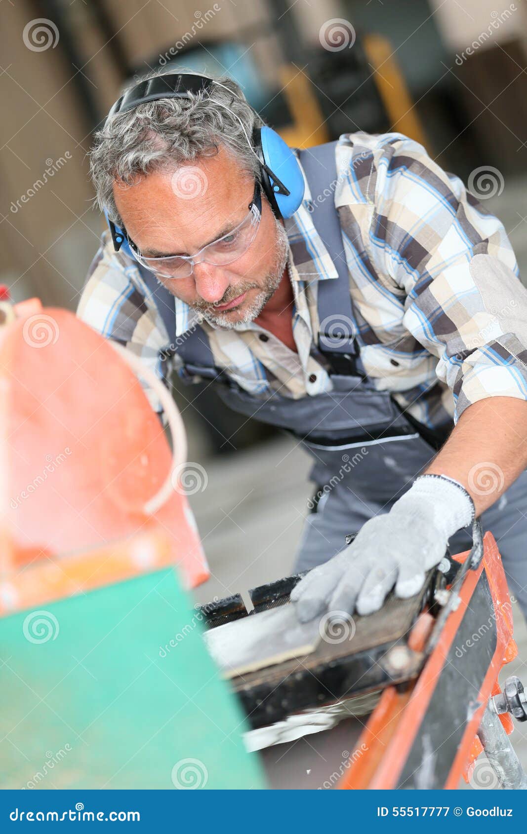 Professional tiler at work stock image. Image of indoors - 55517777