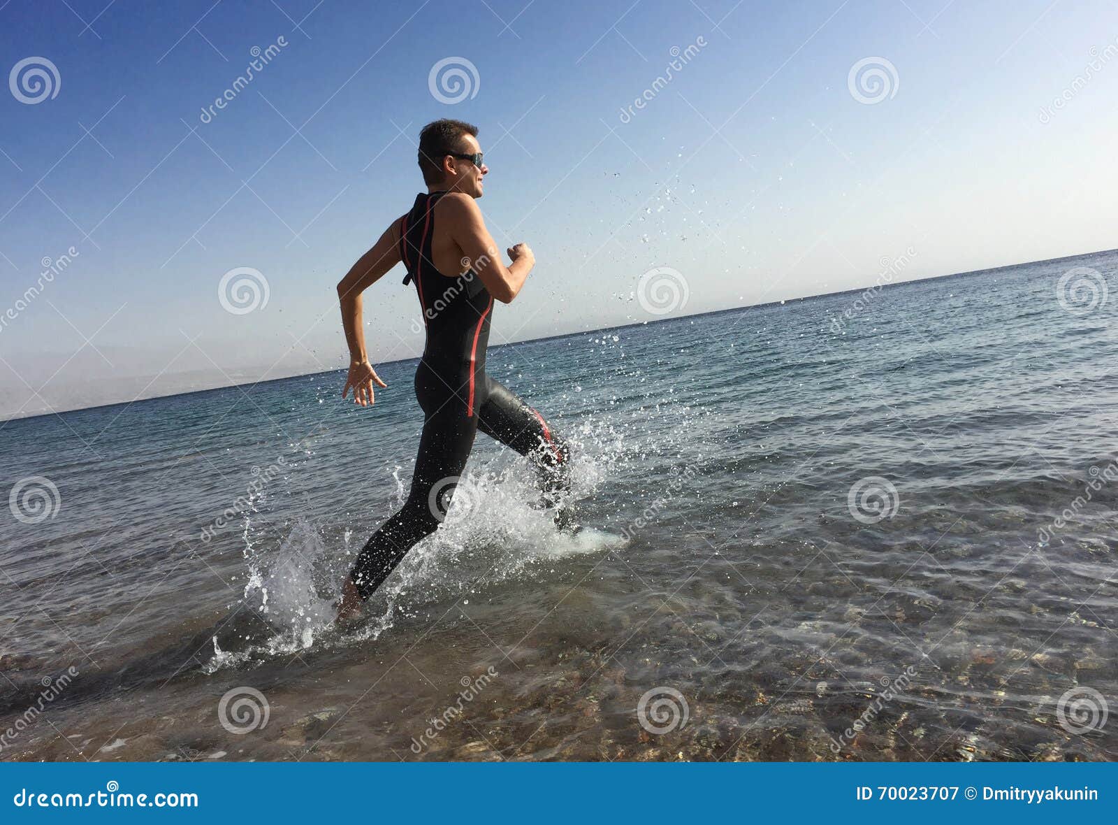 Professional Triathlete Practicing in Open Water. Plunge in Sea Stock ...