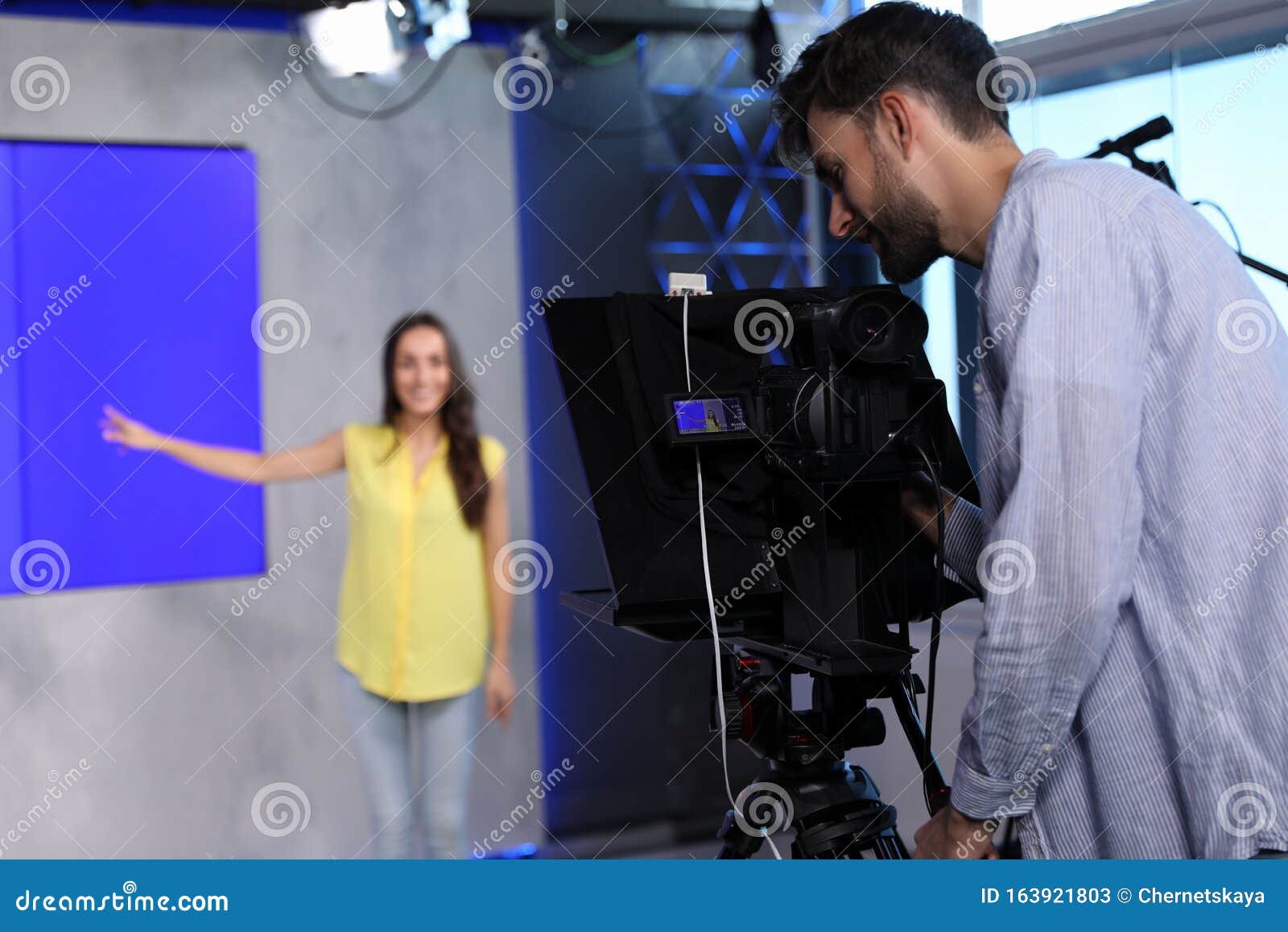 Professional Video Camera Operator and Presenter Working Stock Image ...