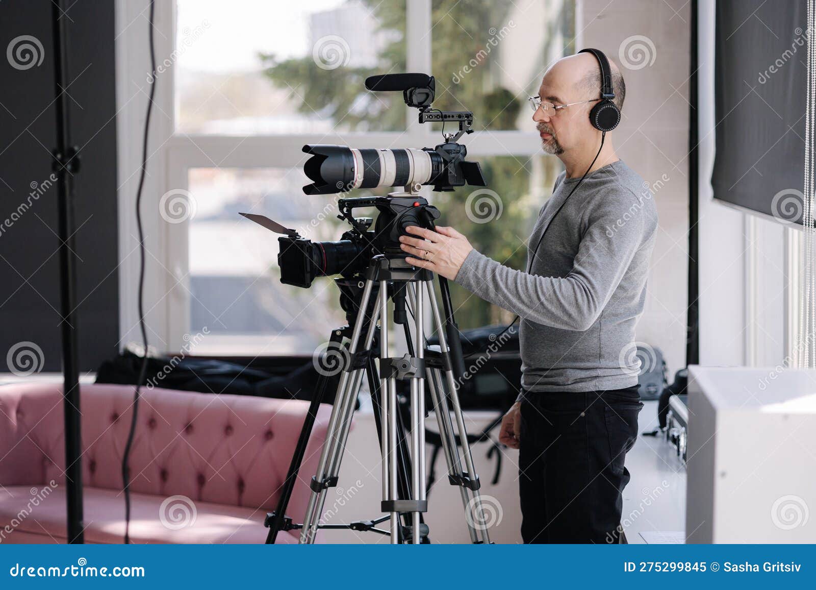 Professional Video Operator Records the Interview. Cameraman Shoots ...