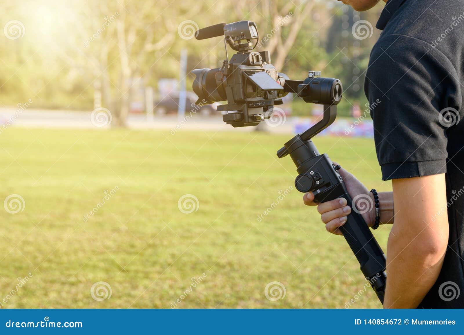 Professional Videographer with Camera on Gimbal Stabilizer for Taking ...