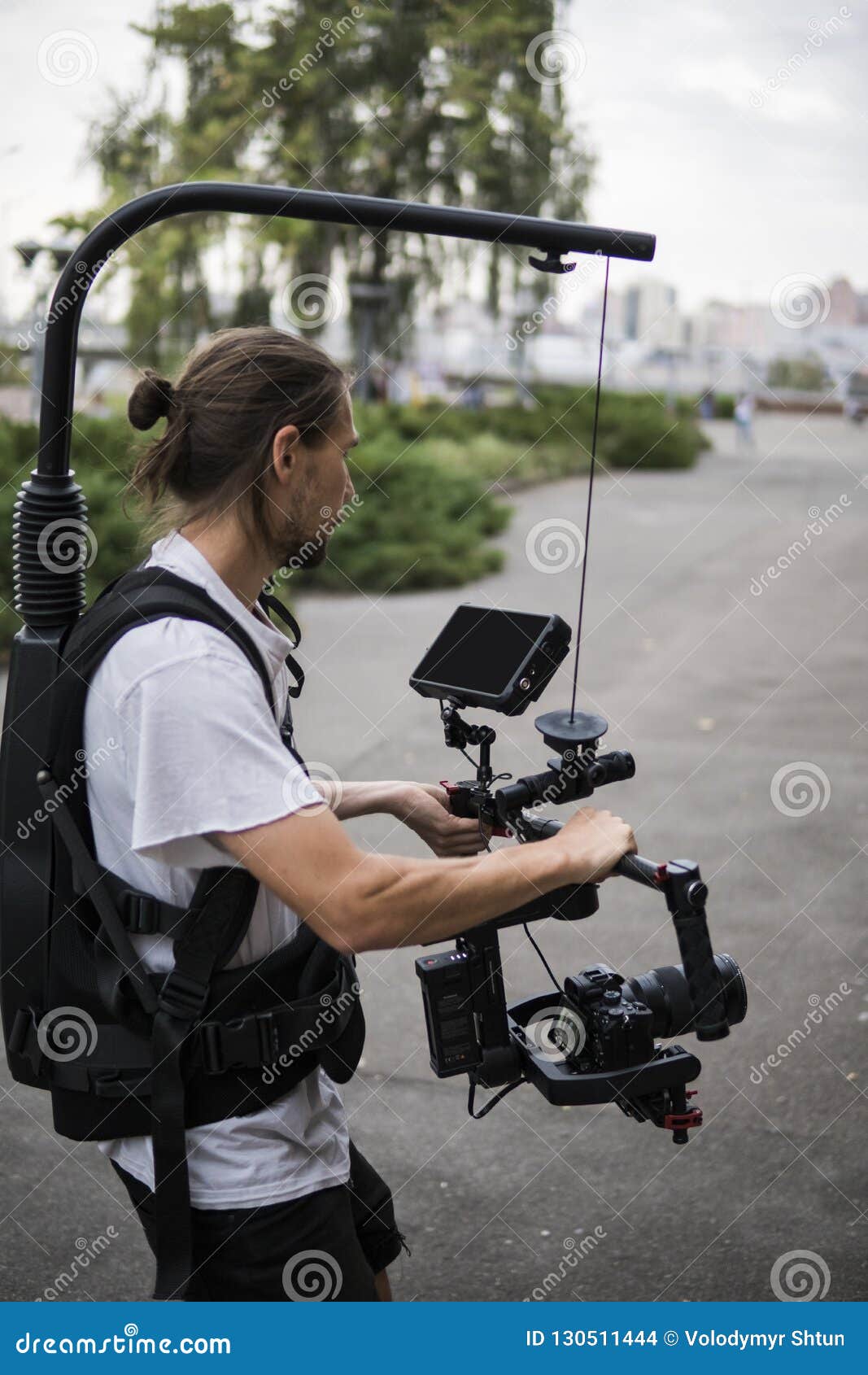 Professional Videographer Holding Camera on 3-axis Gimbal Which Mounted ...