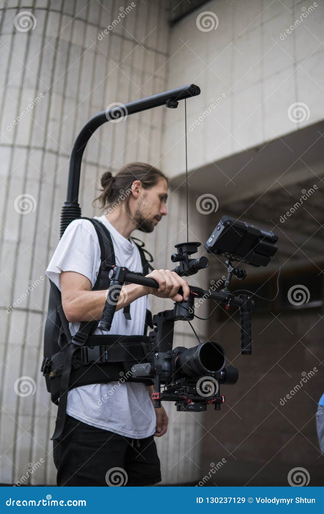 Professional Videographer Holding Camera on 3-axis Gimbal Which Mounted ...